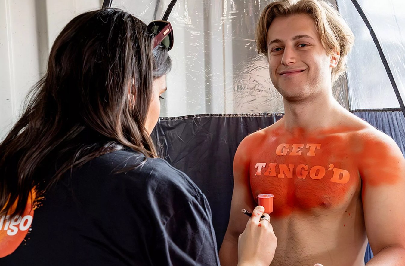 Tango spray paints Londoners orange in exchange for free Majorca ...