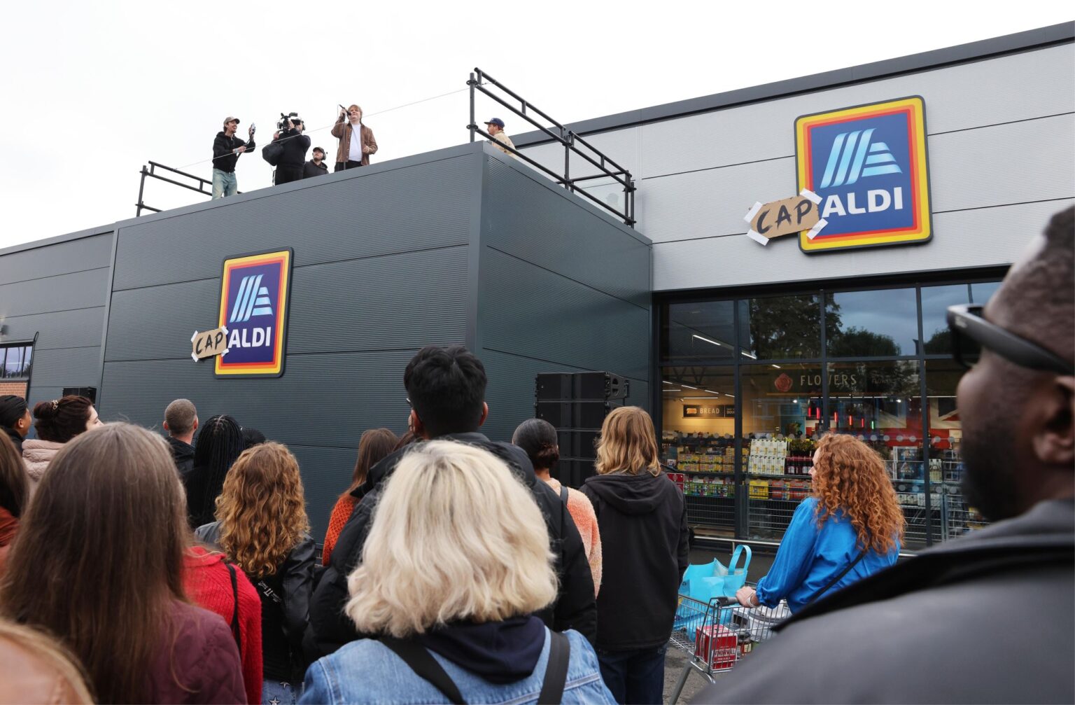 Lewis Capaldi rebrands aldi as “cap-aldi” for surprise rooftop gig ...